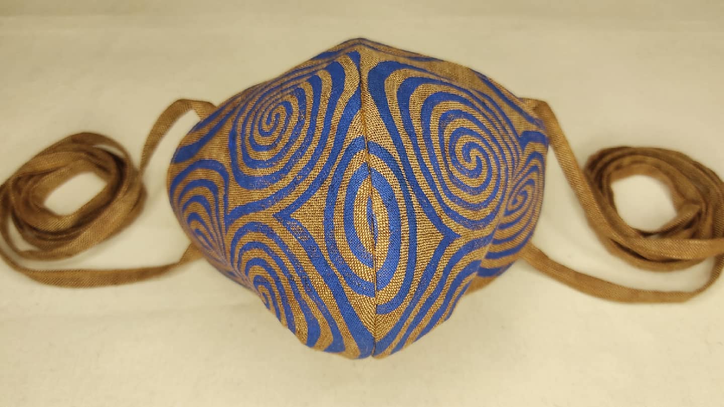 Face mask with Newgrange triple spiral print - brown/blue - Racaire's ...